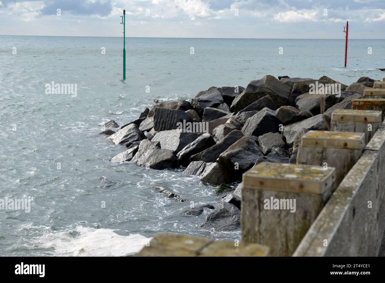 Rock armour against the East Pier at West Bay Stock Photo - Alamy