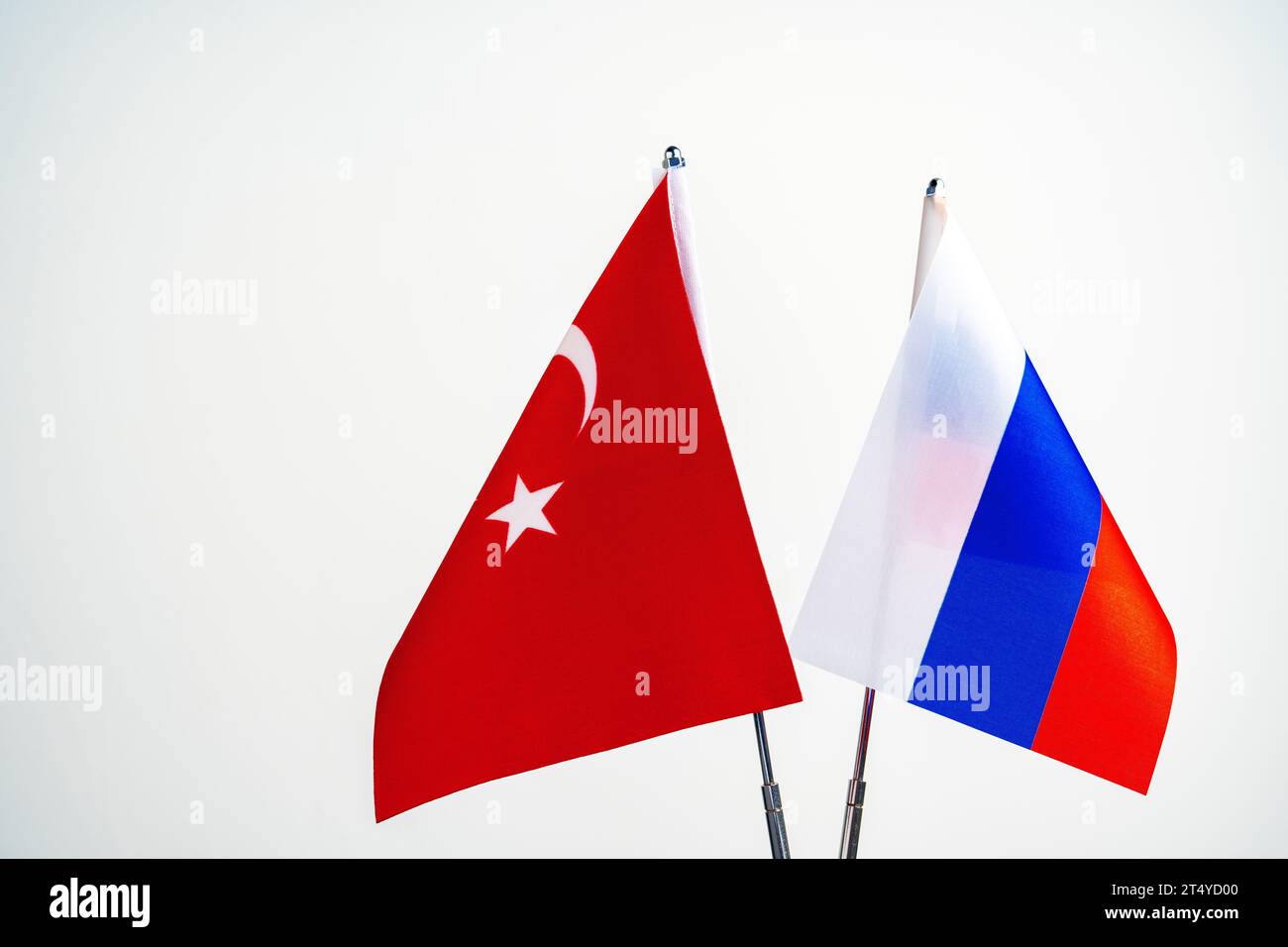 Flags of Turkey and Russia on poles on negotiation table Stock Photo ...