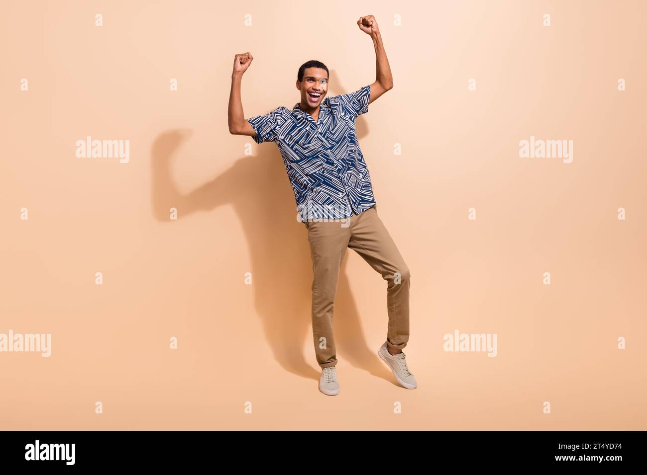 Full length photo of ecstatic overjoyed man dressed stylish shirt brown ...