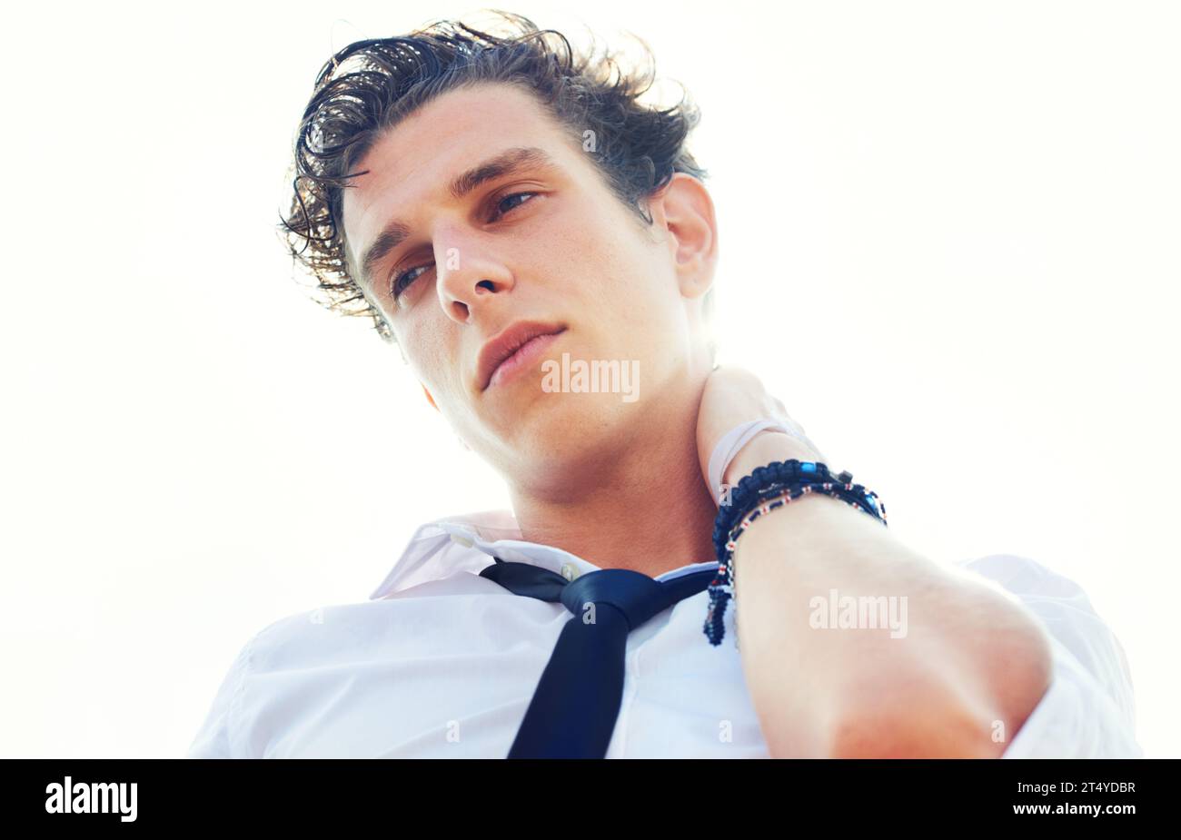 Serious face of man, fashion and confident on white background with ...