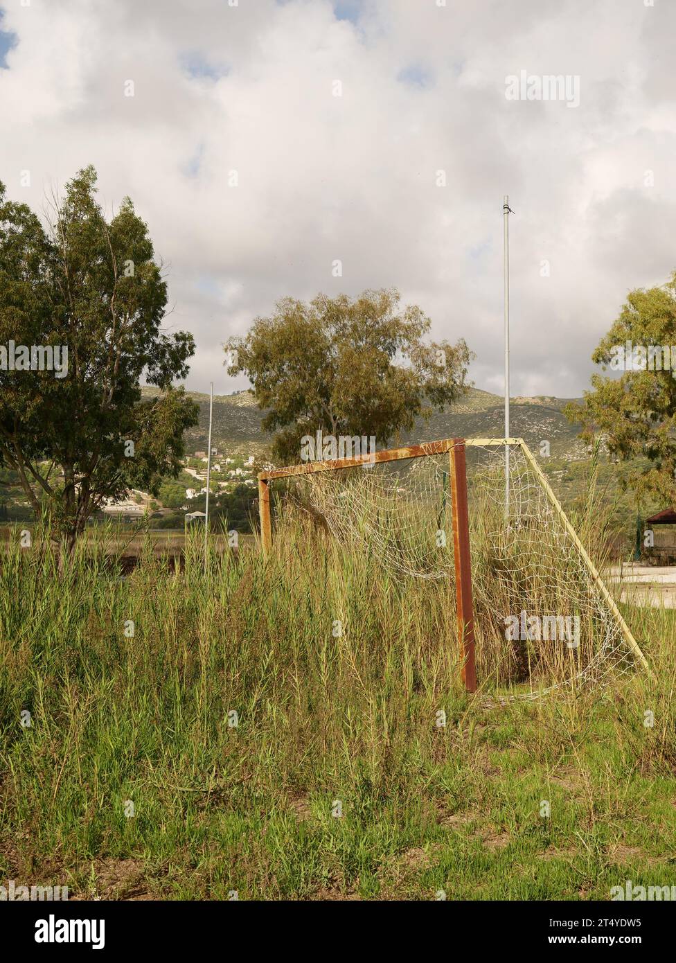Football pitch goal area overgrown and in a state of disrepair Stock ...