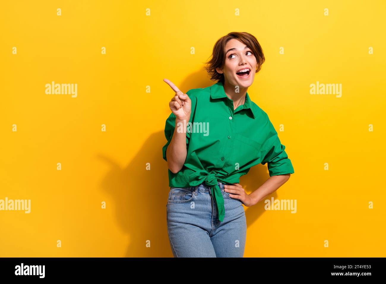 Portrait of amazed promoter lady advertising novelty product direct ...