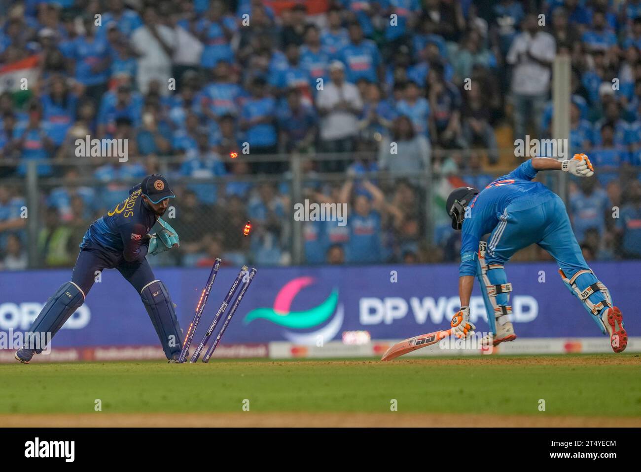 Sri Lanka's captain Kusal Mendis, left, successfully takes a run out to ...