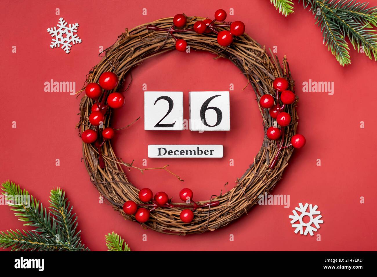 Christmas wreath and wooden calendar with date December 26 on red ...