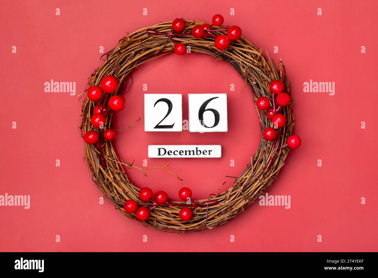 Christmas wreath and wooden calendar with date December 26 on red ...