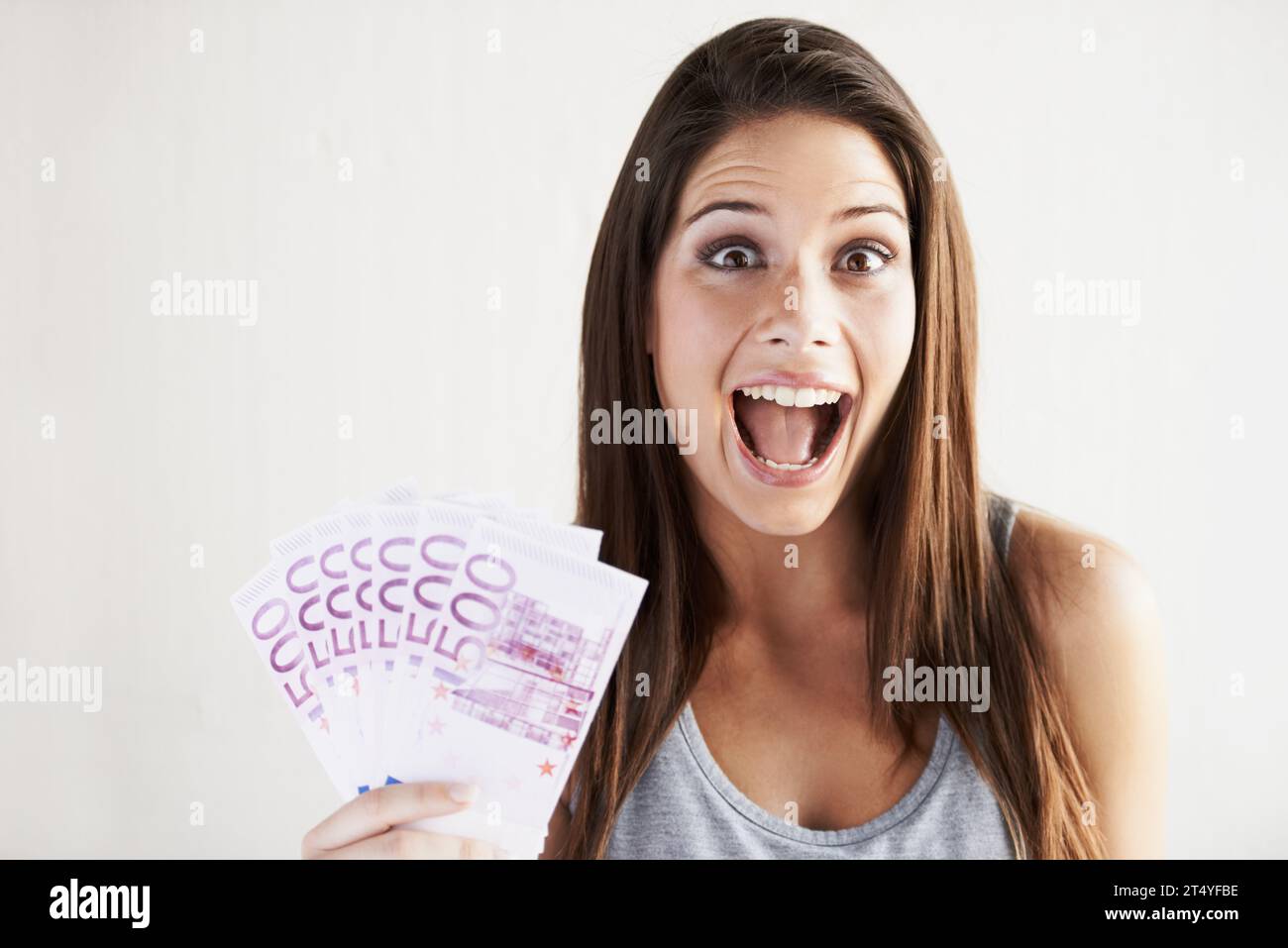 Rich excited woman cash money hi-res stock photography and images - Alamy