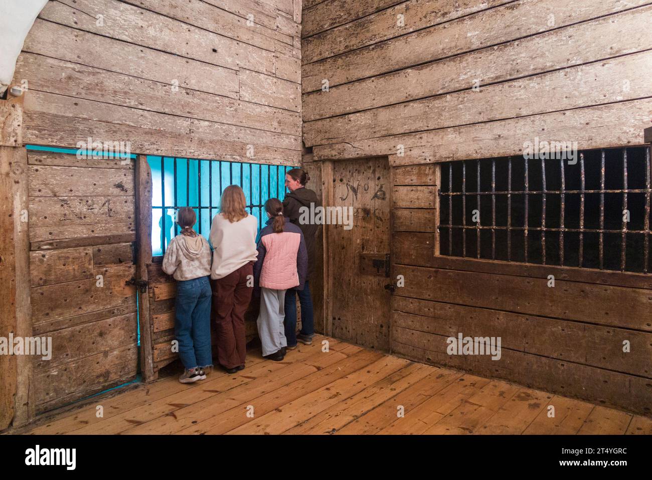 Castle prison, or gaol. Visitor tourist family learn about how women ...