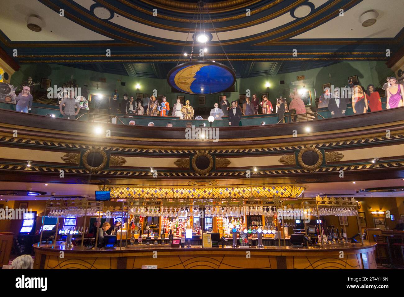 Circle seating & mannequins above bar inside The Playhouse Wetherspoon ...