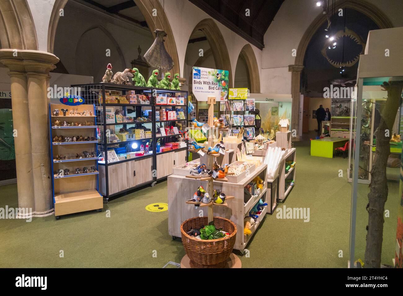 Display in gift shop, foreground, and permanent exhibition, background ...
