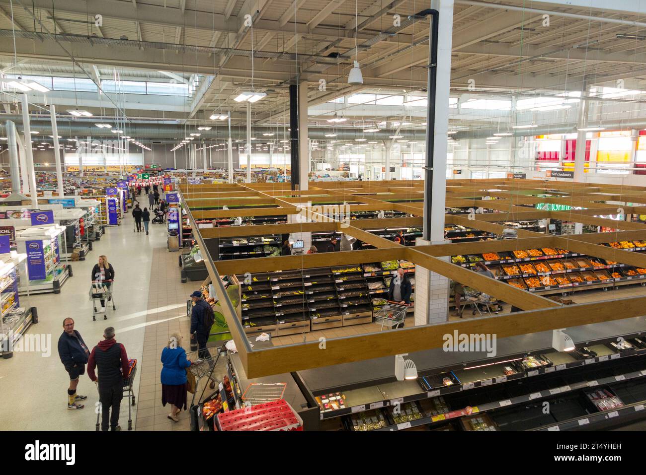 Slightly elevated view of shop floor of large Sainsbury's supermarket ...