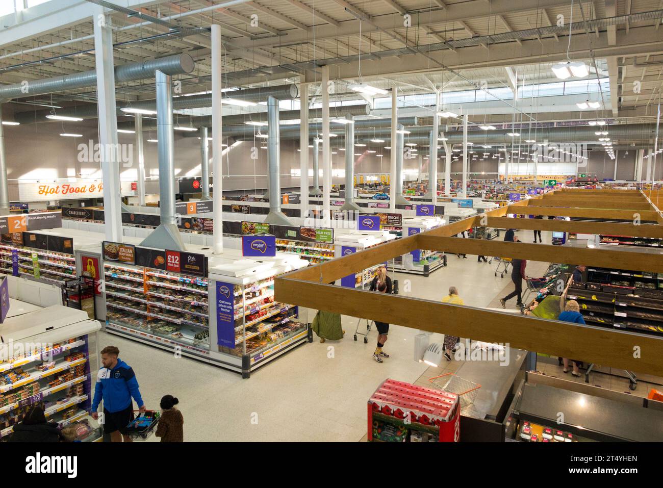 Slightly elevated view of shop floor of large Sainsbury's supermarket ...