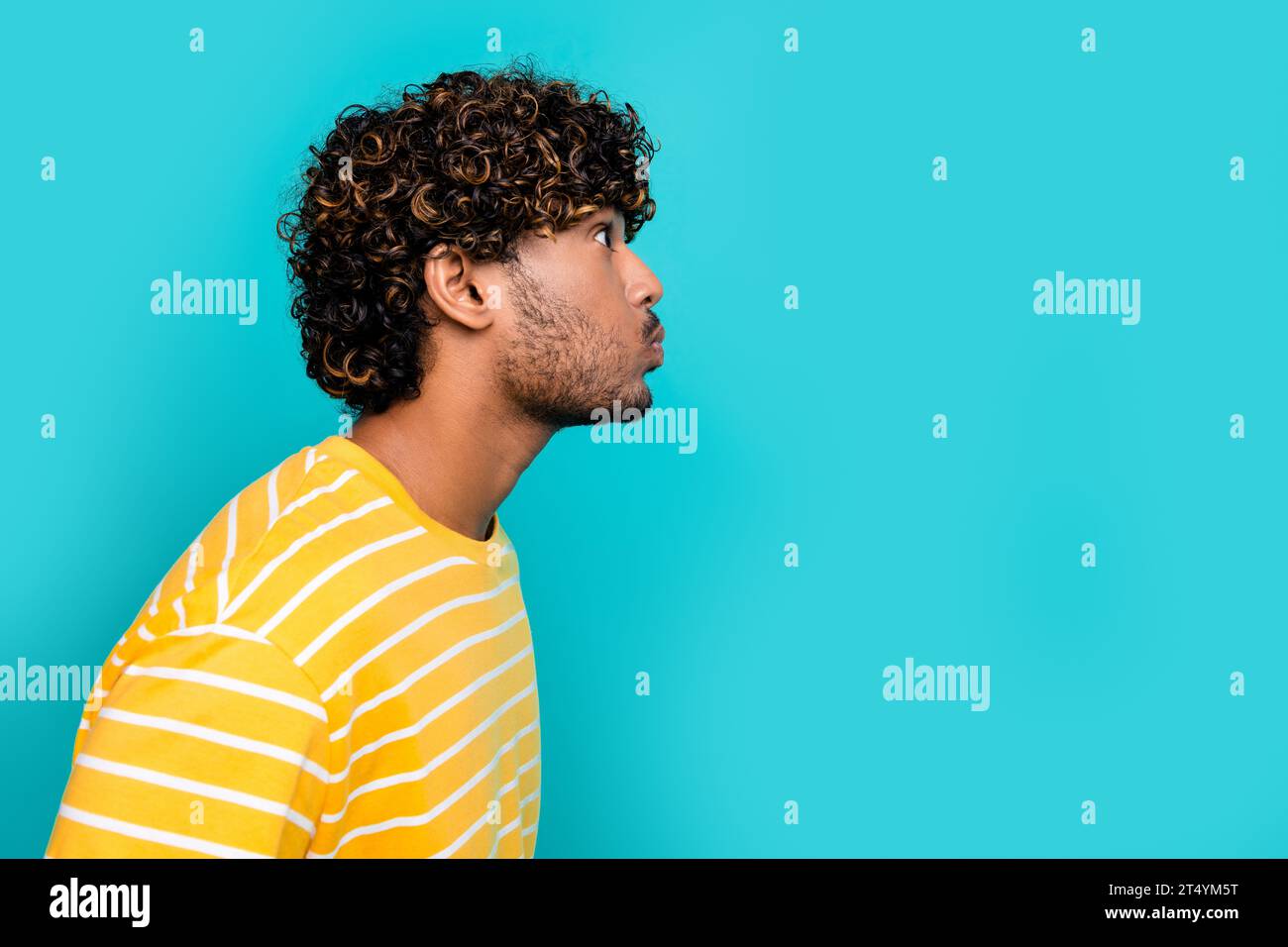 Profile portrait of carefree african guy pouted cheeks hold breath look ...