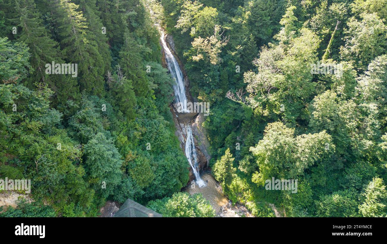 Waterfall flowing in the green forest. Local name manle waterfall ...
