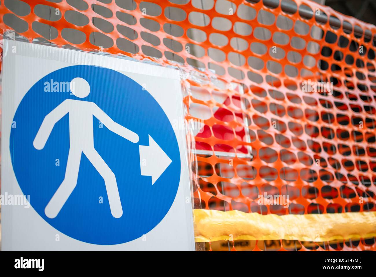 Traffic signal direction of pedestrian crossing for works with orange ...