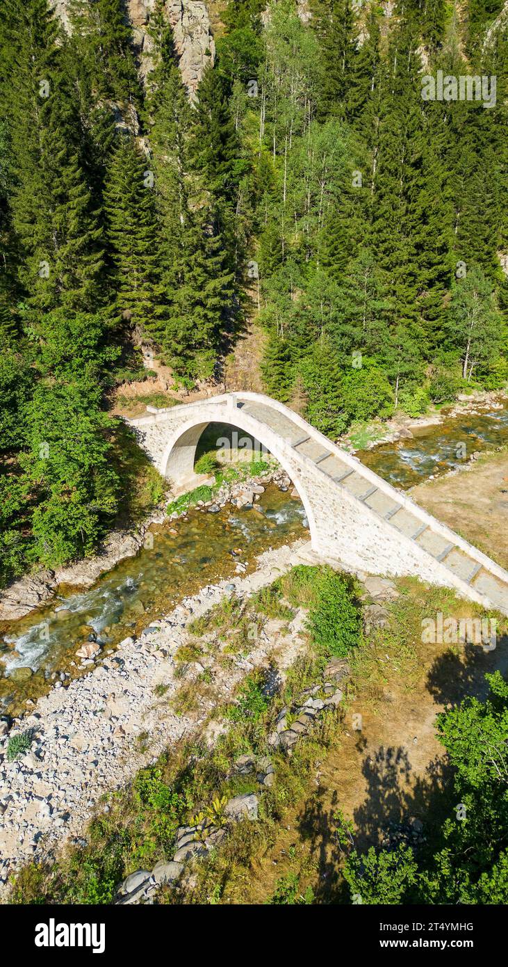Historical stone bridge. Historical stone bridge built over the river ...