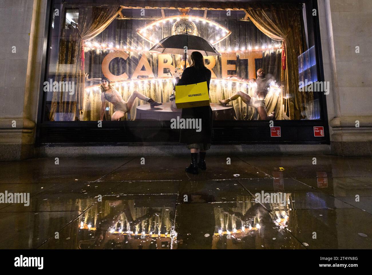 EDITORIAL USE ONLY The Kit Kat Club Prologue dancers in the window at ...