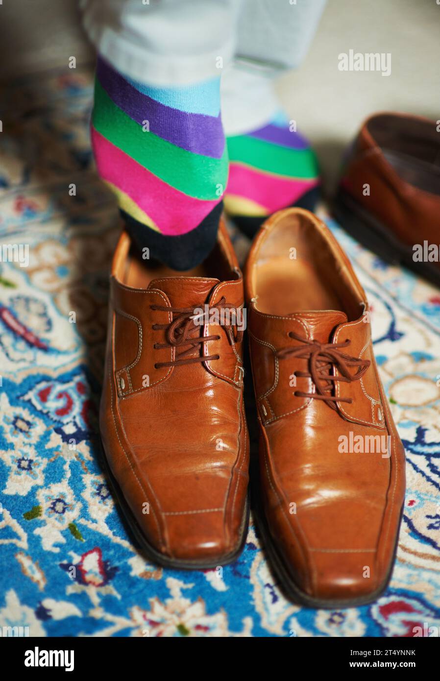 Man getting ready, shoes and socks in home, putting on business fashion ...