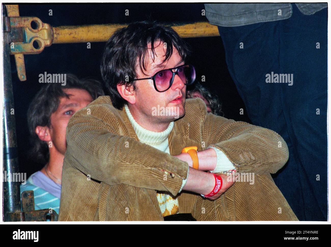 JARVIS COCKER, BACKSTAGE, 2000: Jarvis Cocker, the lead singer of Pulp, sitting side stage to ...
