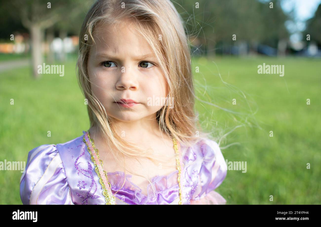 Portrait of a Little girl with blonde hair thinking about something ... Portrait of a Little girl with blonde hair thinking about something ...