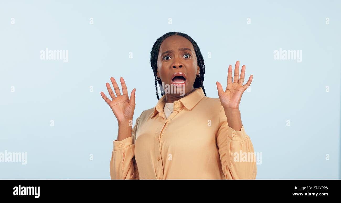 Black woman, fear and shock in studio portrait for anxiety, drama or ...