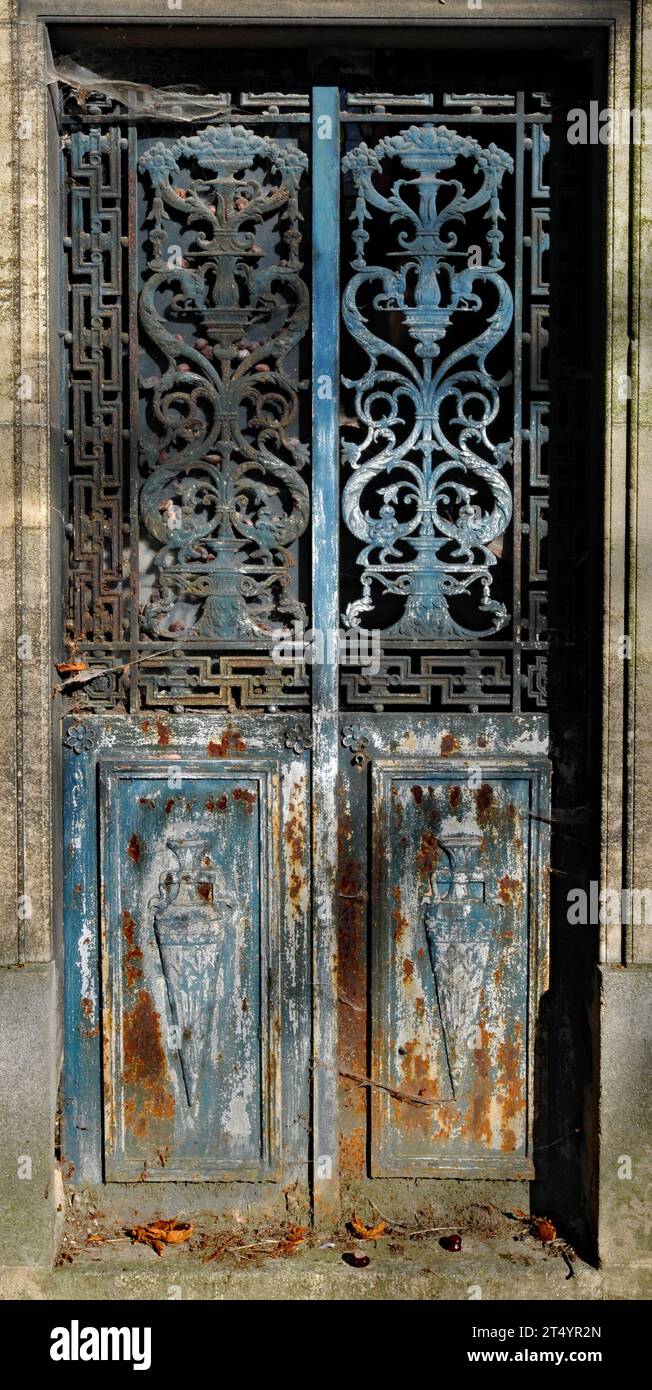 Detail of a rusting, ornate door at the entrance to a mausoleum in ...