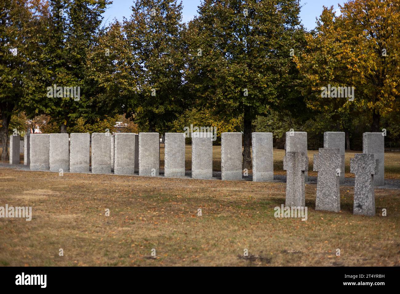 Stone tombstones in the German cemetery in the fall. Beautiful German ...