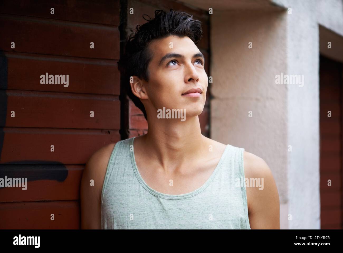 Man, smile and thinking of future, wall and outdoors for fashion, cool ...