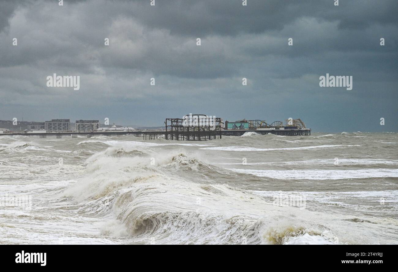 Brighton UK 2nd November 2023 - Waves roll in by Brighton's two piers ...