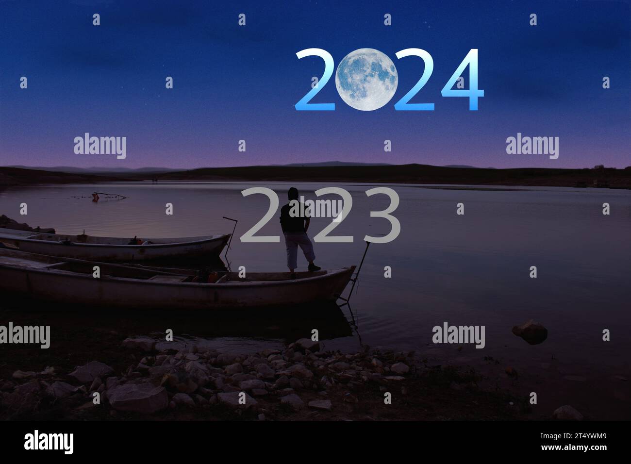 Man watching the bear from the boat by the lake. full moon at top of ...