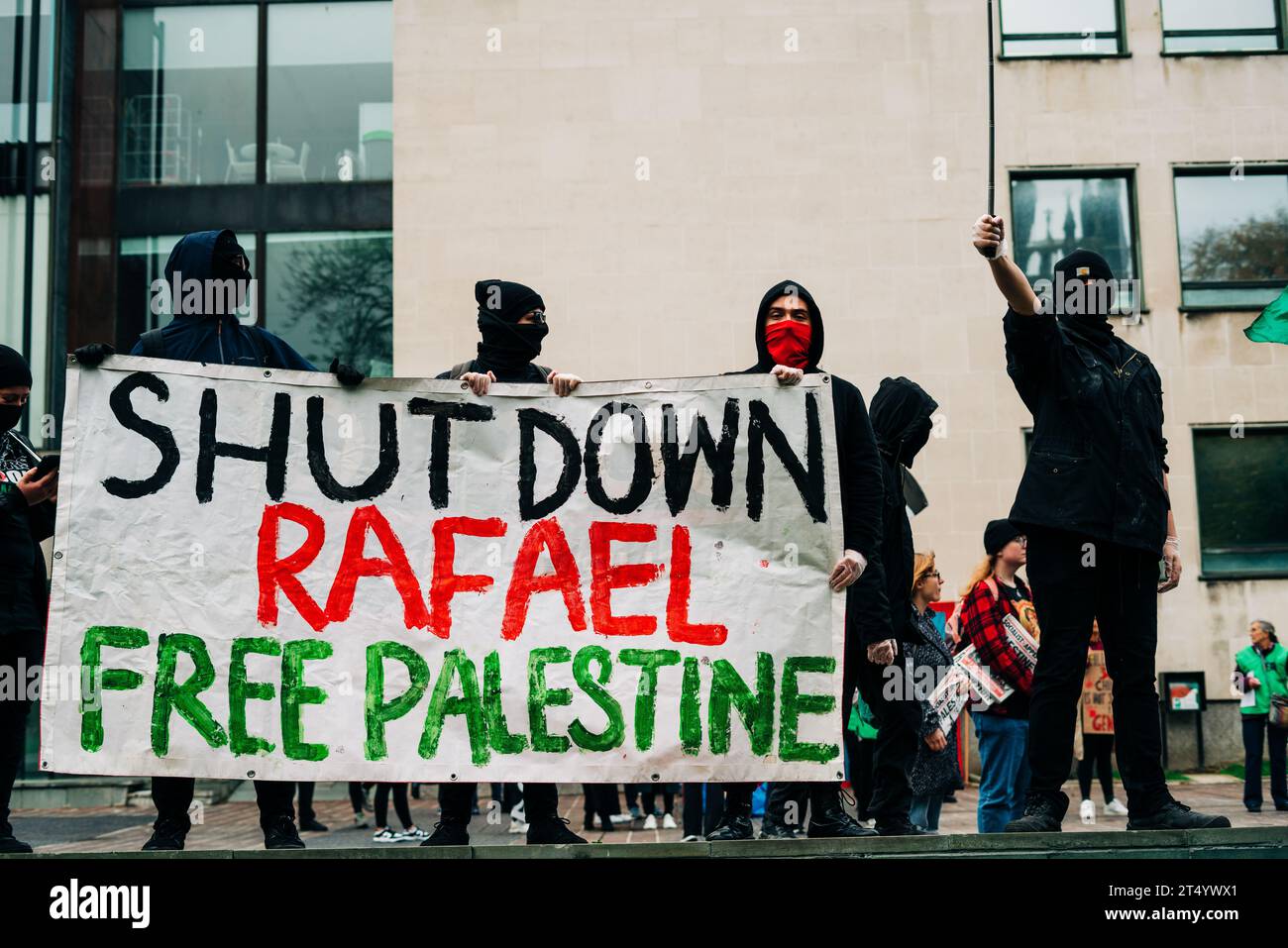 Protesters hold flag that reads "Shut Down Rafael Free Palestine' at ...
