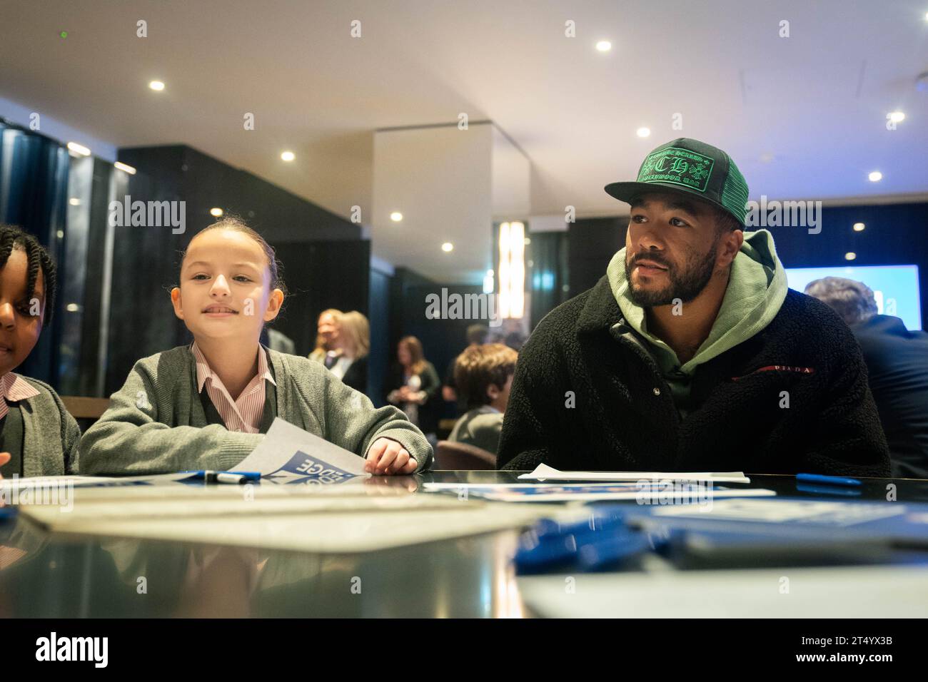 Chelsea FC captain Reece James, talks to children during an an anti ...