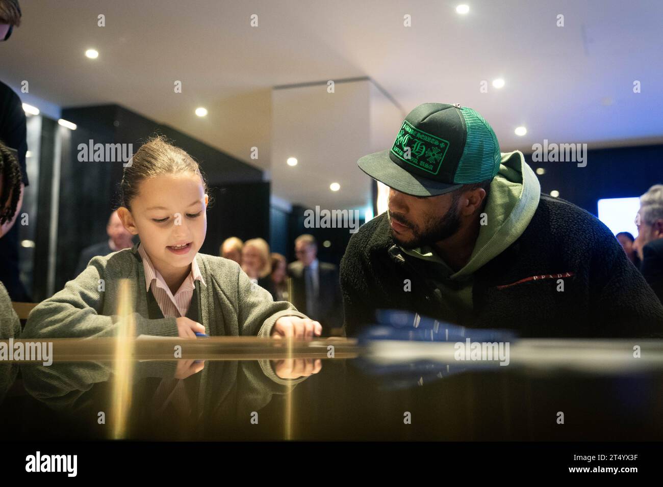 Chelsea FC captain Reece James, talks to children during an an anti ...