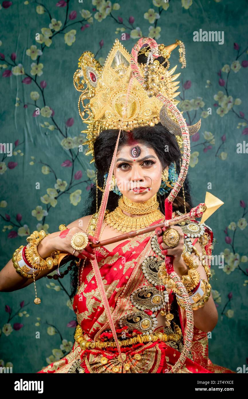 Portrait of beautiful Indian girl of Durga Idol Agomoni Concept Indoor ...