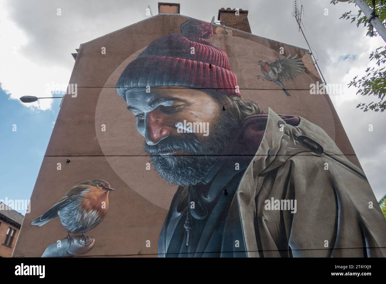 Mural showing a man with a small bird on his finger and another bird ...