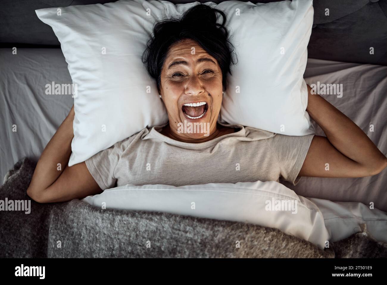 Screaming, above and a woman in bed with mental health, stress or ...