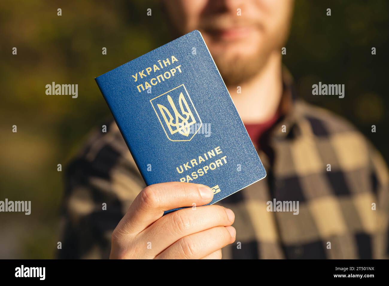 New Ukrainian blue biometric passport with identification chip in hands ...