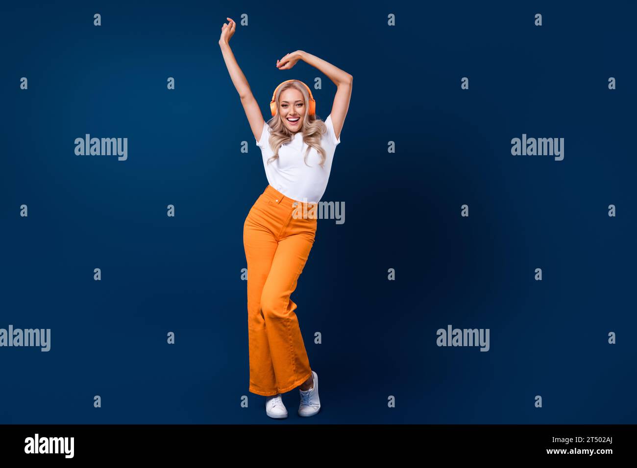 Full length photo of cheerful glad girl listening soundtrack dancing ...