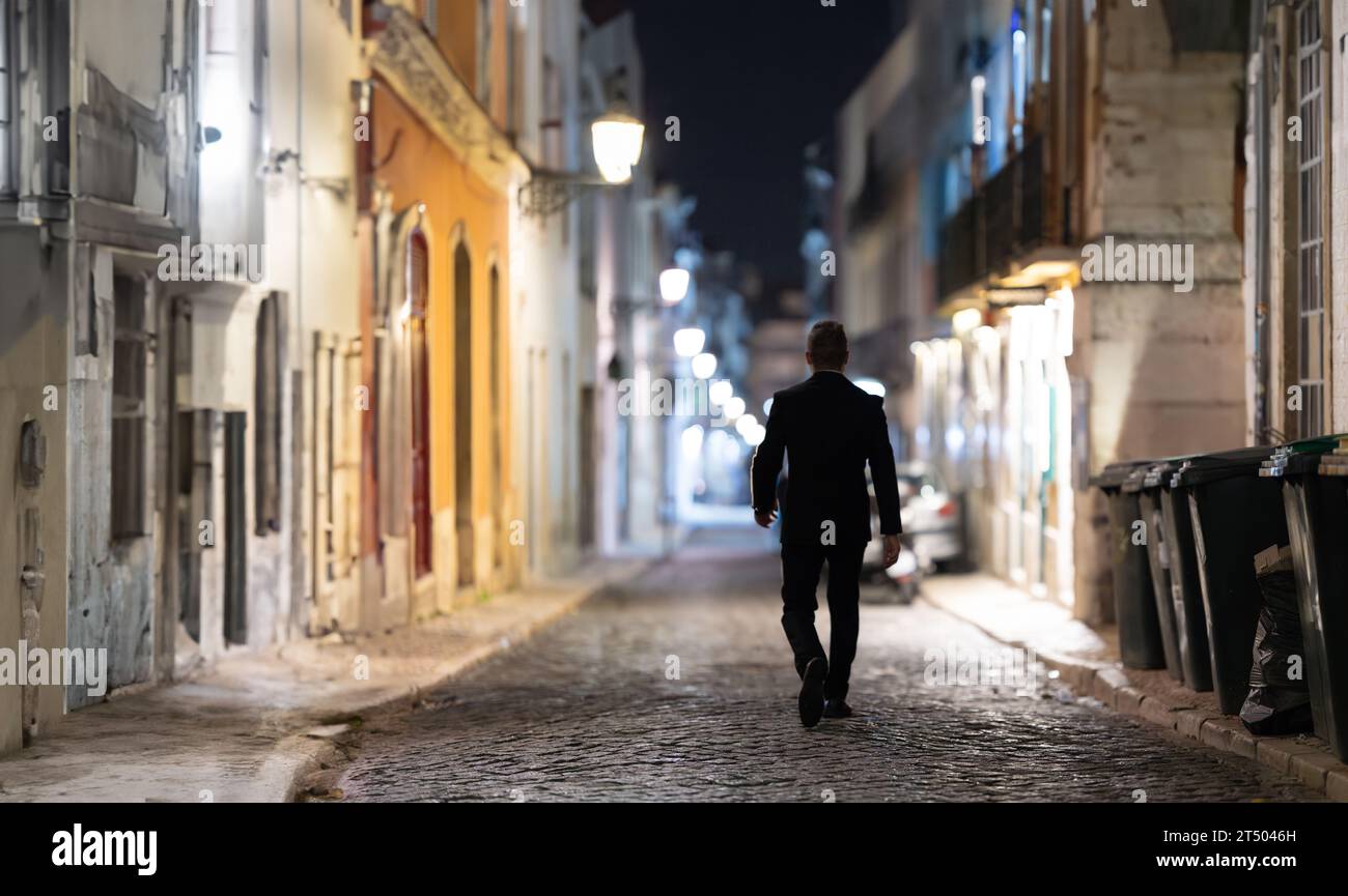 Tourist man walking through alley hi-res stock photography and images ...