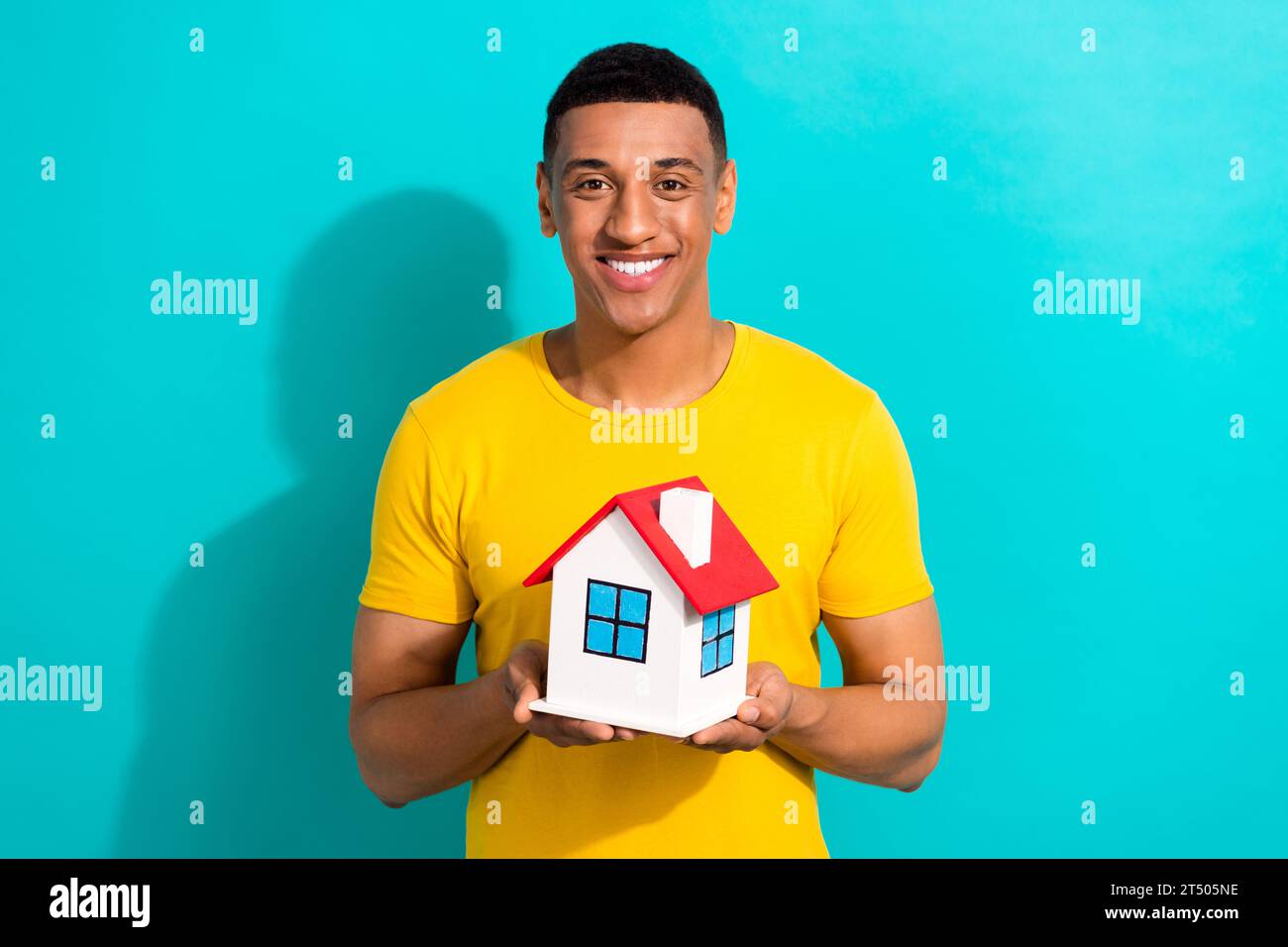 Photo of young man apartments miniature building house relocation rent ...