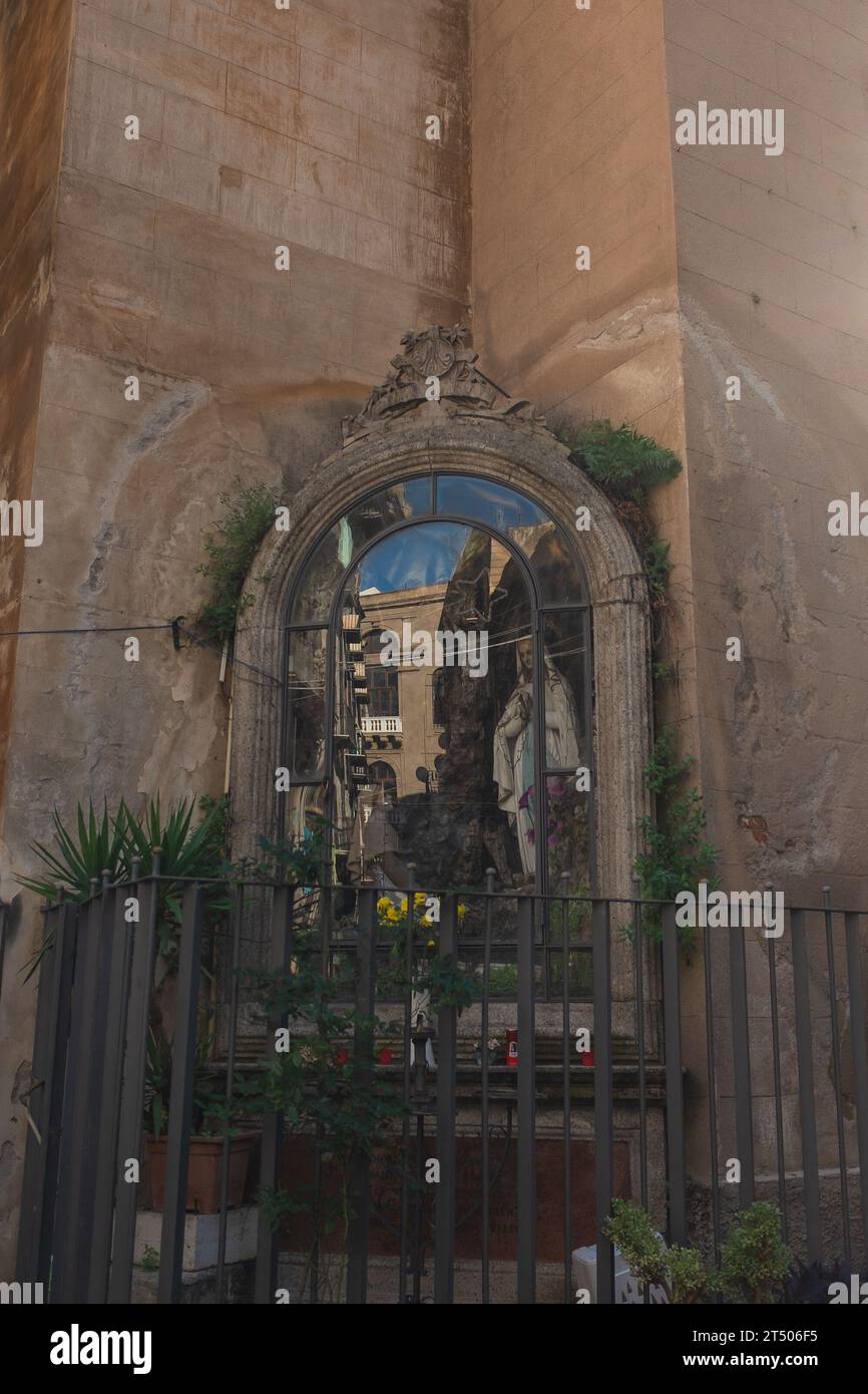 Palermo, Sicily, 2016. A street shrine containing a statue of the ...