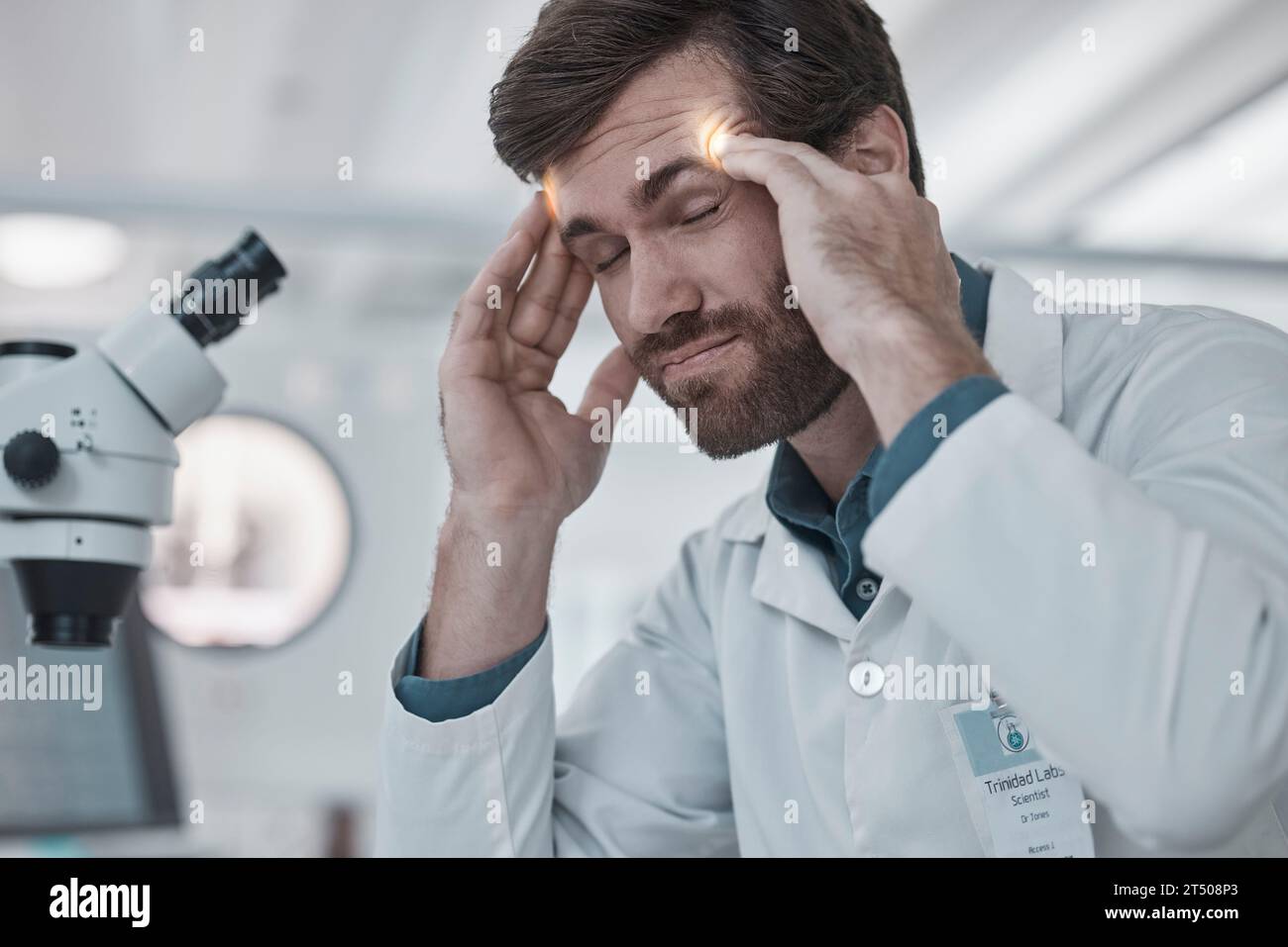 Stress, doctor or scientist with headache in a laboratory suffering ...