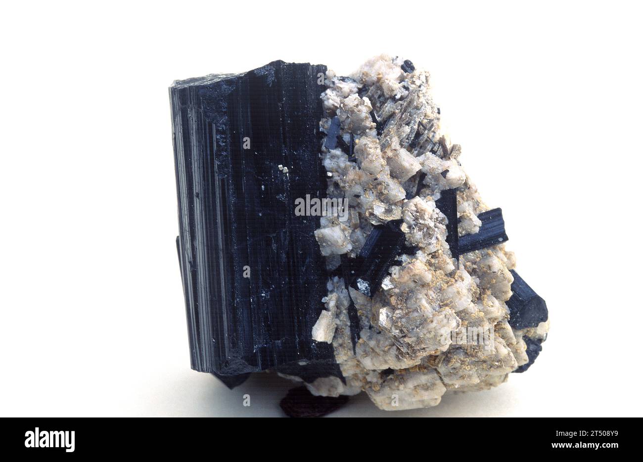 Tourmaline is a boron silicate mineral. Black prismatic crystals on ...