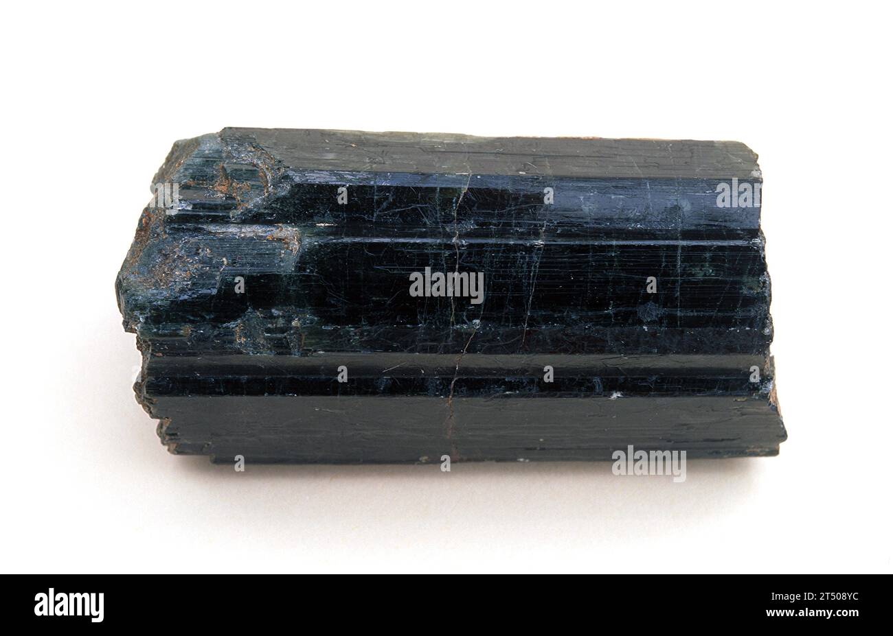 Tourmaline is a boron silicate mineral. Black prismatic crystal Stock ...