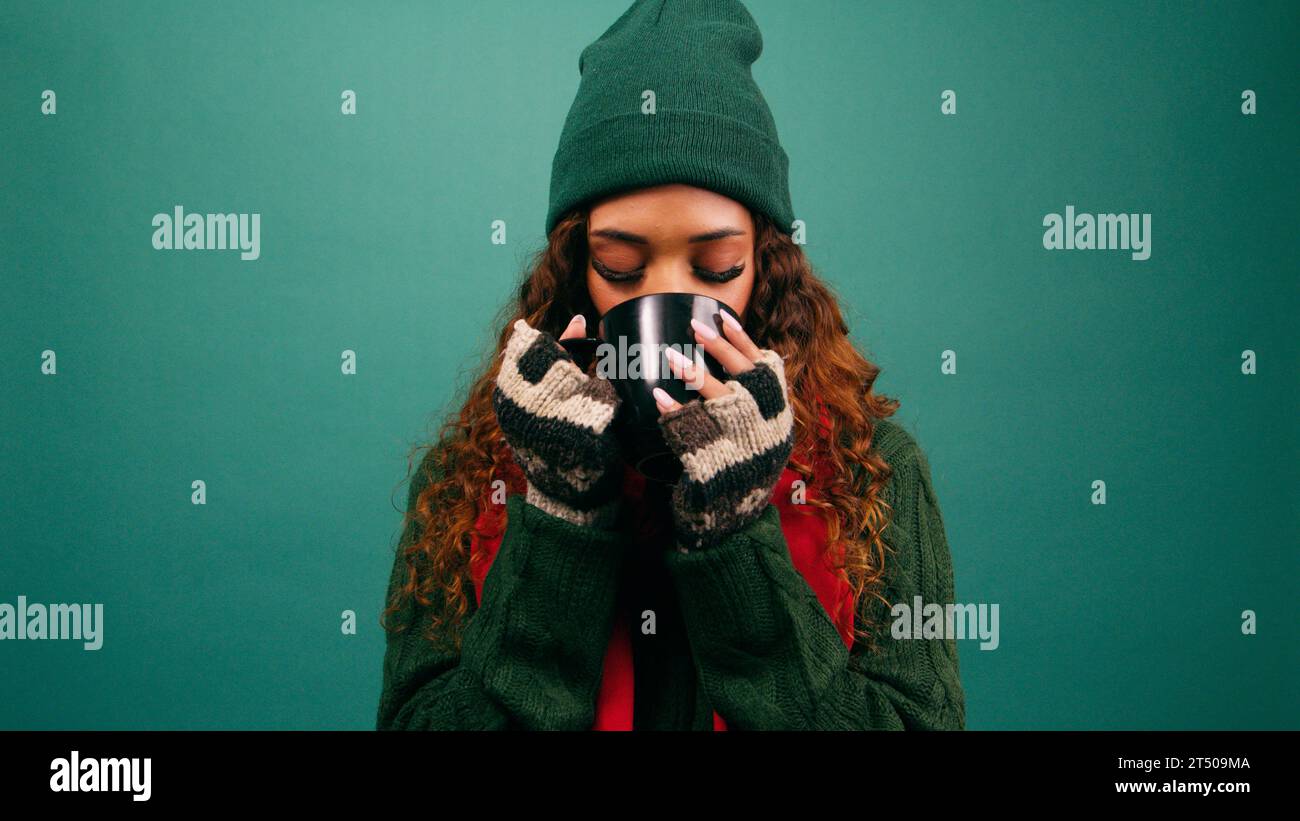 Beautiful young woman sips warm hi-res stock photography and images - Alamy
