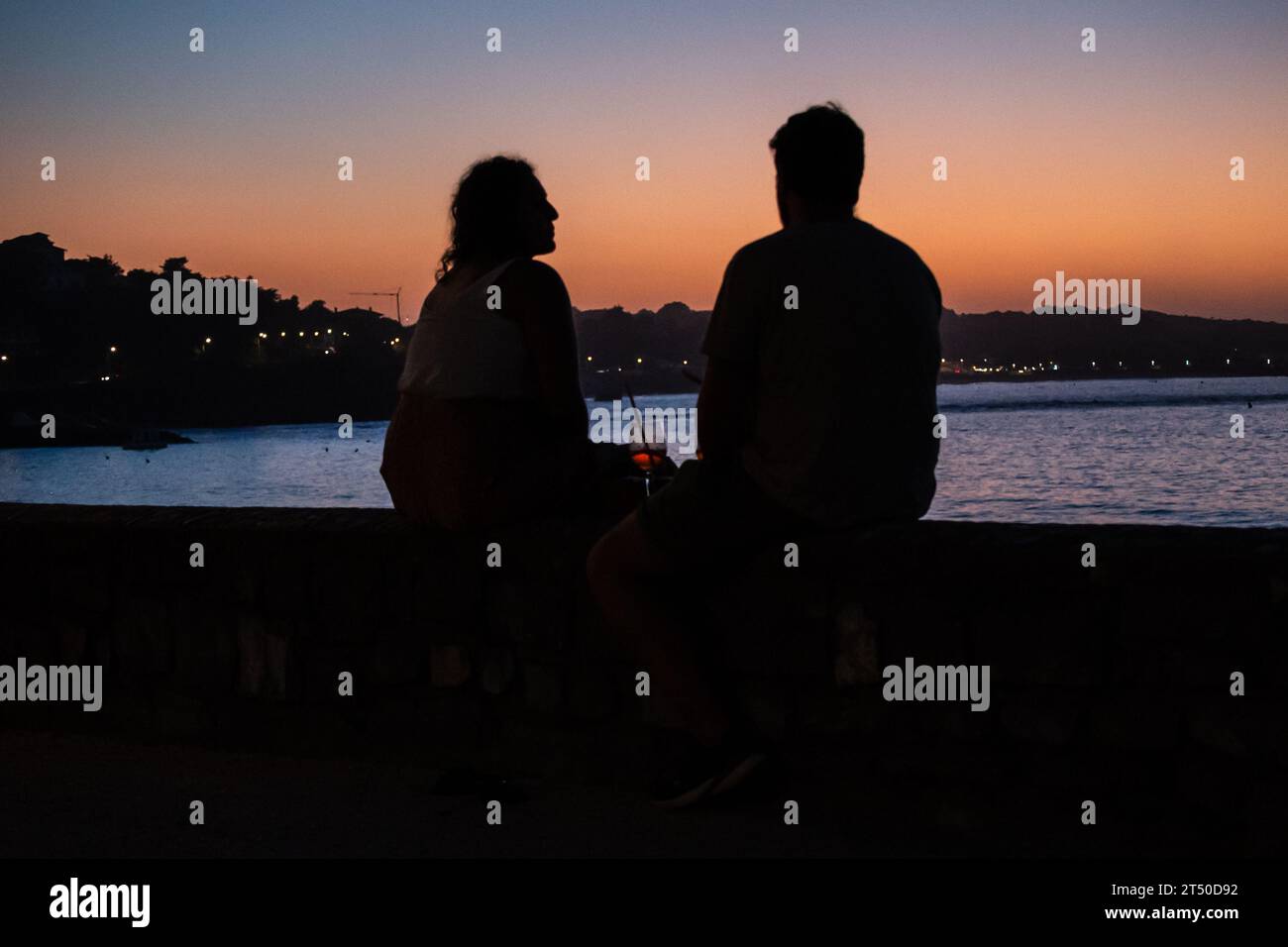 Couple enjoying a drink at sunset, Promenade Jacques Thibaud boardwalk ...