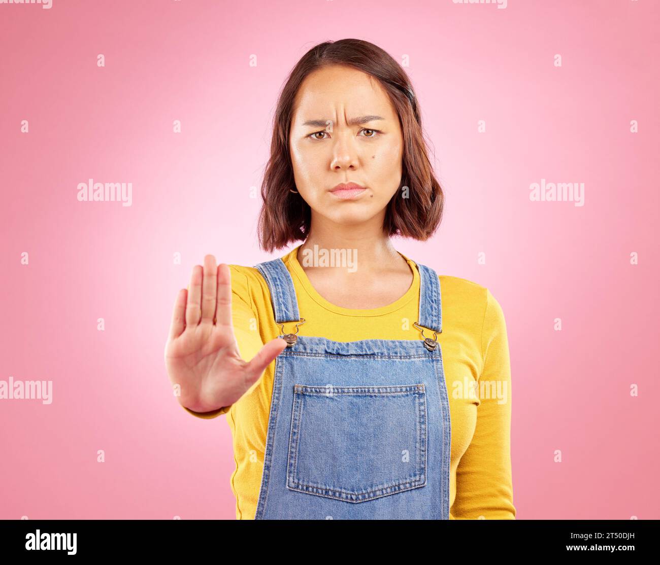 Woman, palm and stop in studio portrait with angry face, rejection or ...
