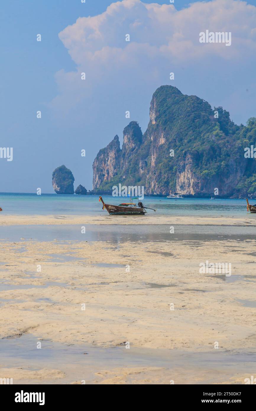 Photo of a boat stranded at low tide on the island of Phi Phi Island ...
