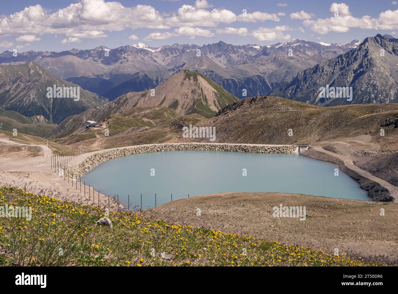 A resorvoire of turquoise water in the Austrian Alps mountains Stock ...