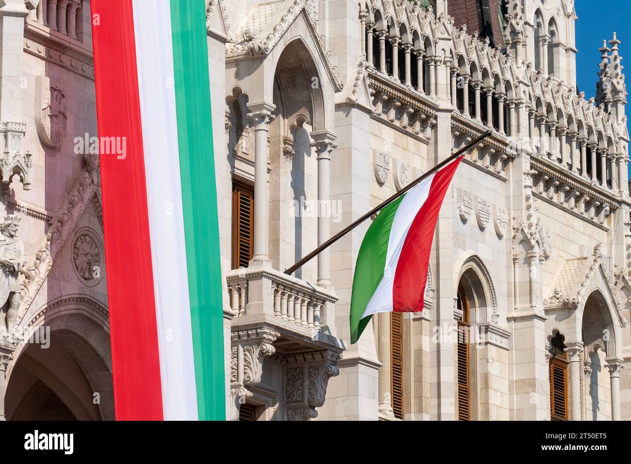 The neo-Gothic building of the Hungarian legislature, the Parliament, is decorated with flags in ...