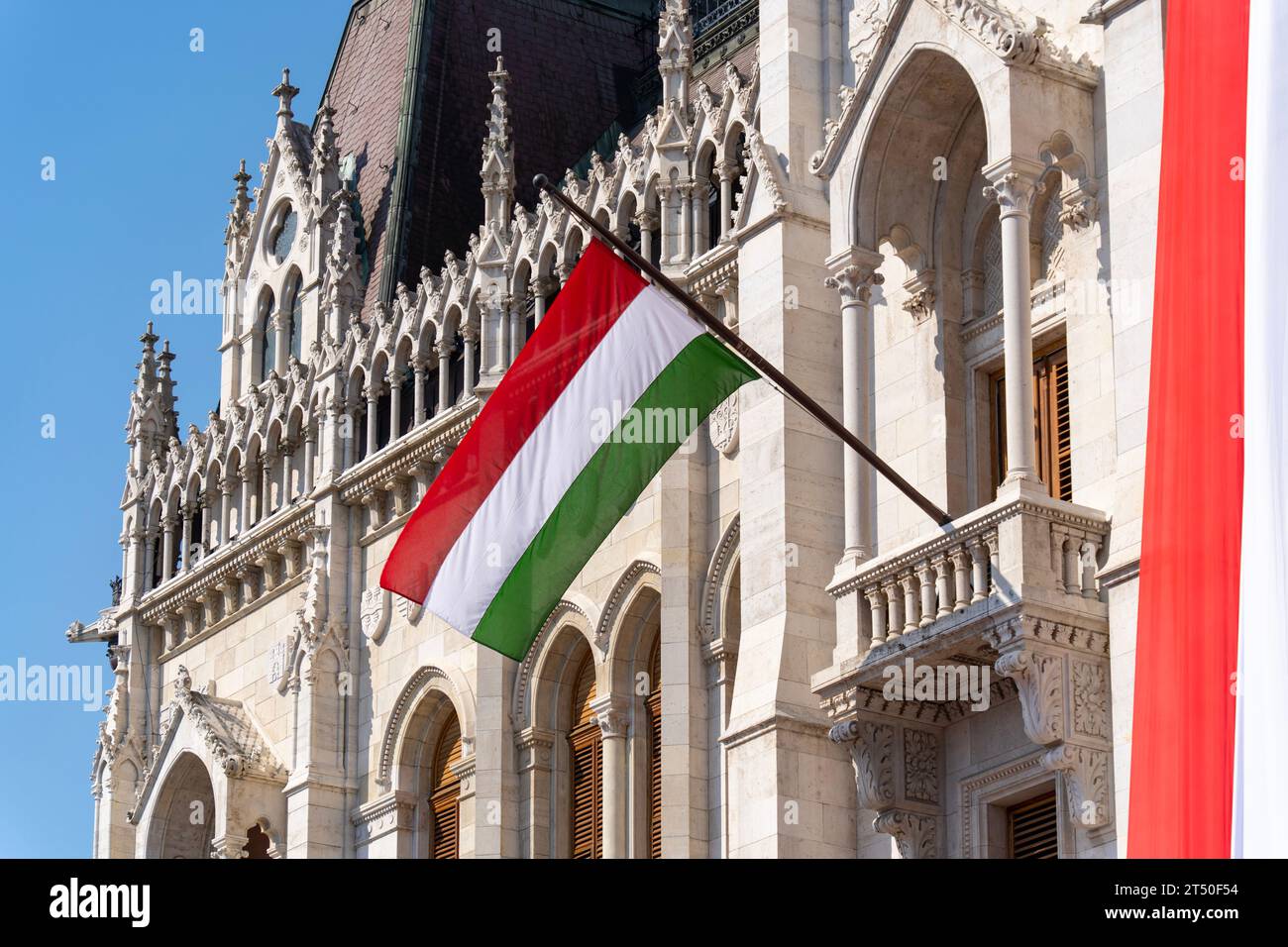 The neo-Gothic building of the Hungarian legislature, the Parliament, is decorated with flags in ...
